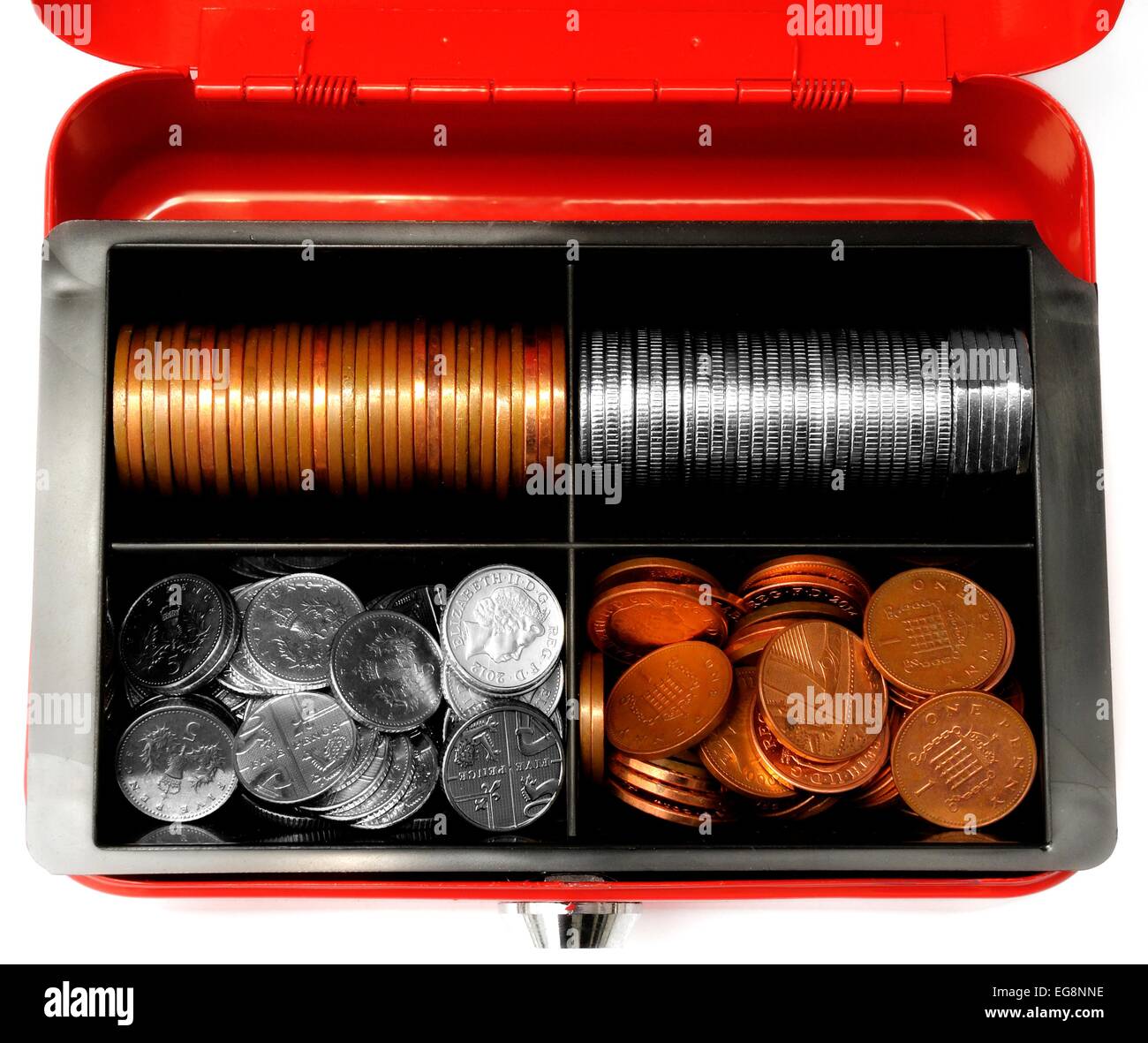 A red petty cash tin with British copper and silver coins inside Stock ...