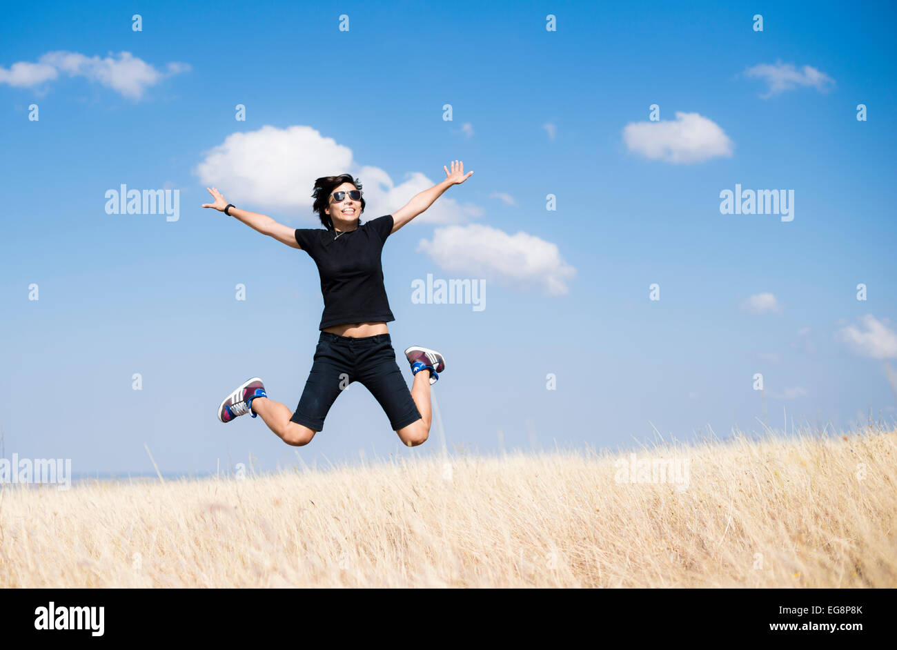 Happy woman jump Stock Photo - Alamy