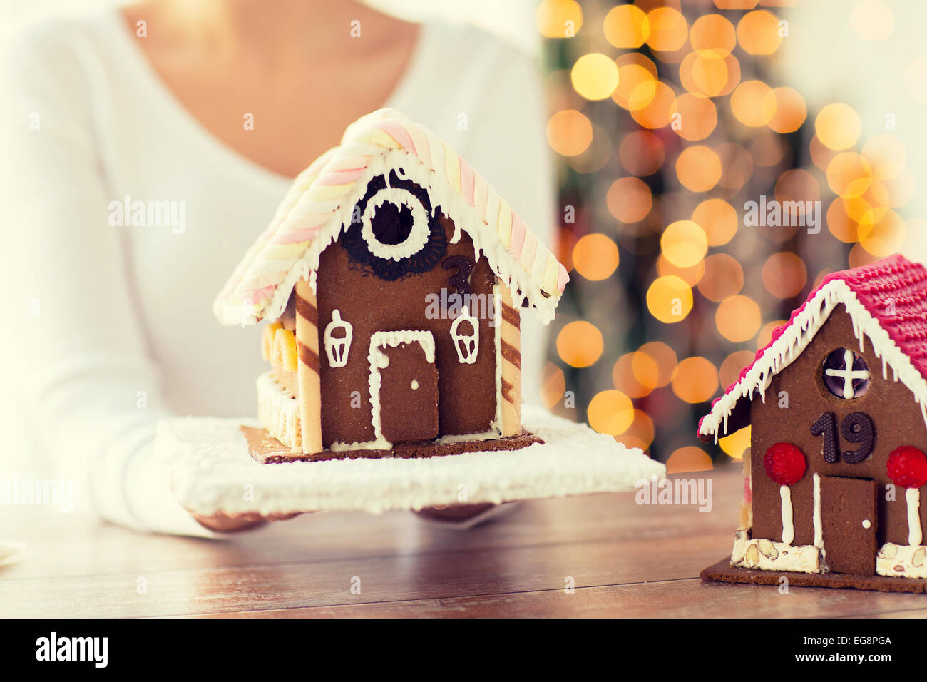 close up of woman showing gingerbread house Stock Photo - Alamy