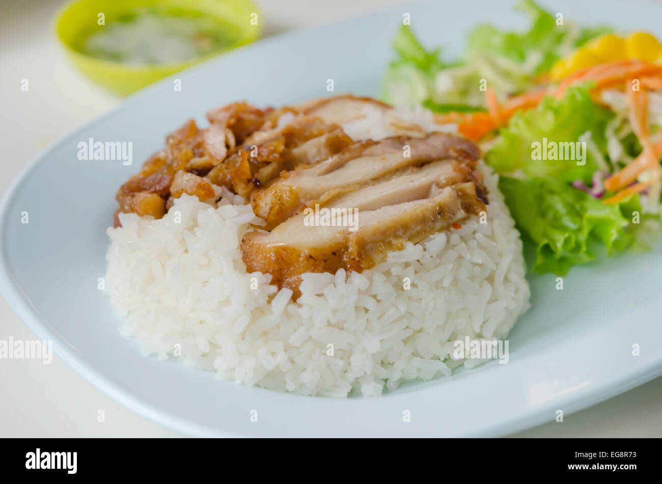 close up fried Chicken over steamed rice on plate Stock Photo - Alamy