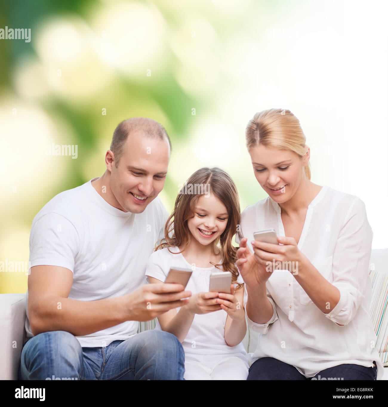 happy family with smartphones Stock Photo - Alamy
