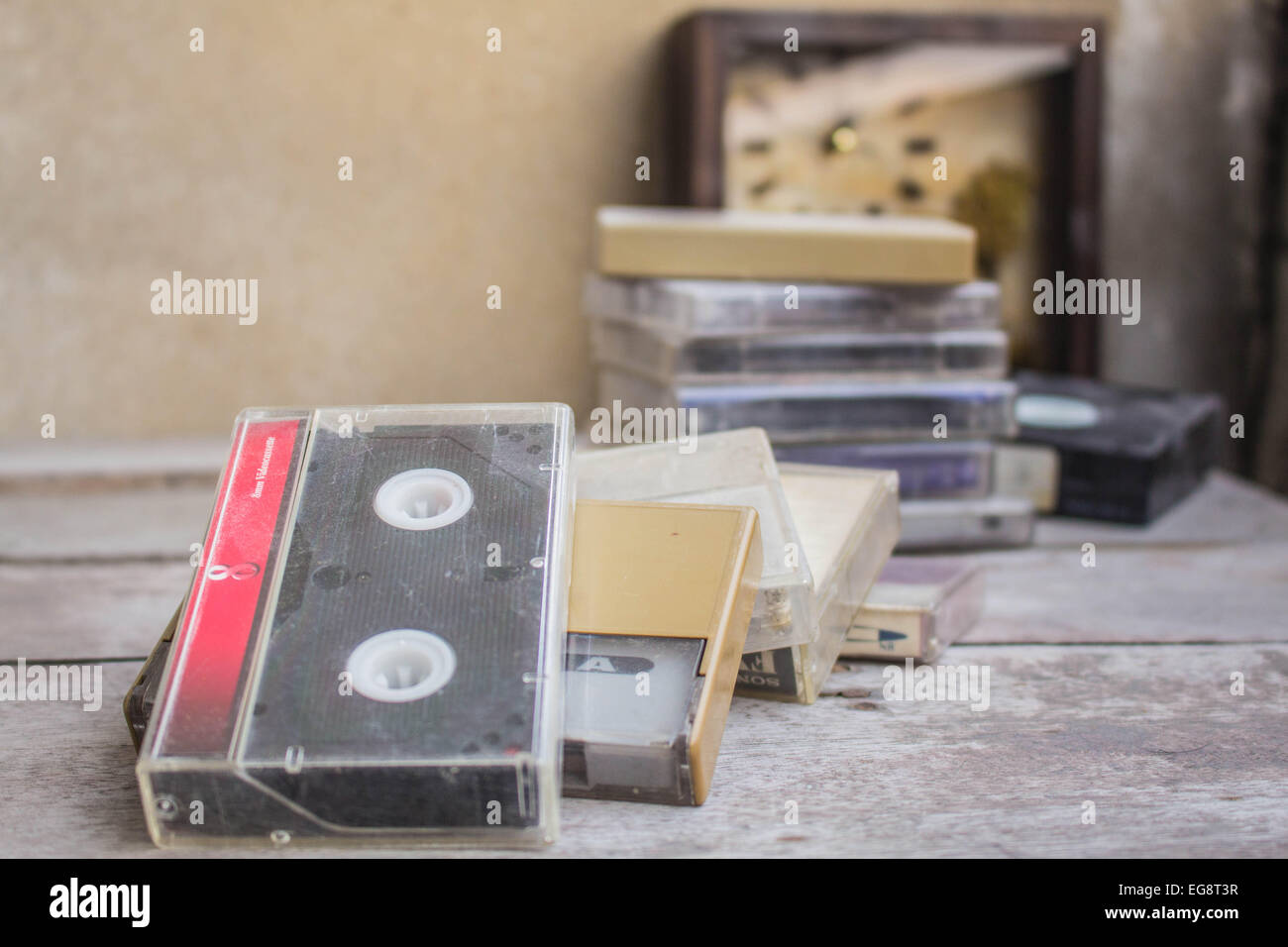 Old cassette arranged on a wooden Stock Photo - Alamy