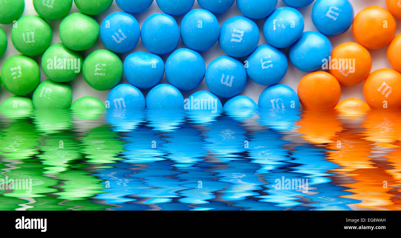 M and M's reflected into a digitally created pool of water Stock Photo ...