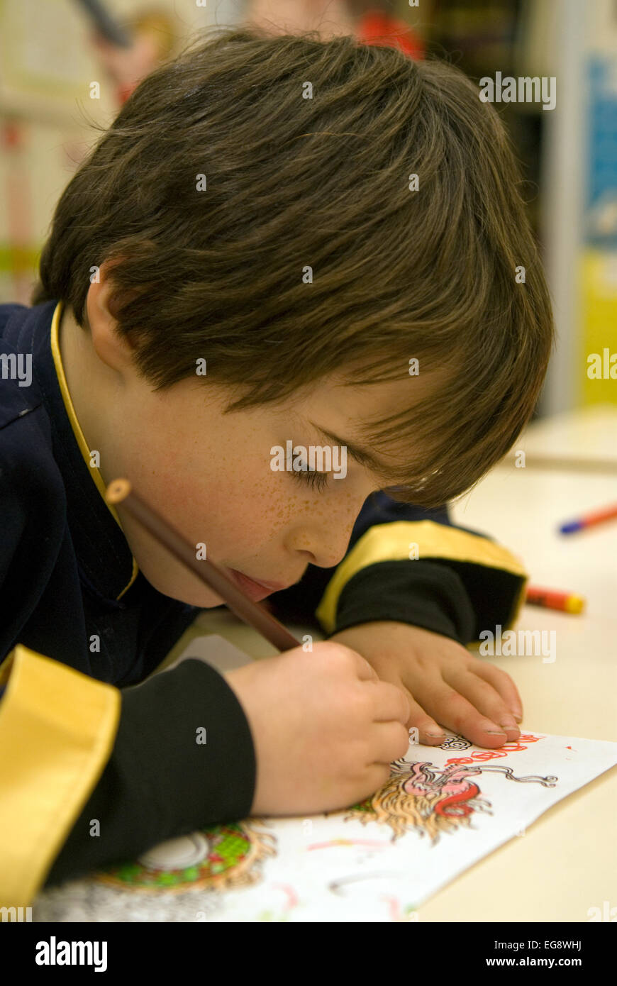 Pupil colouring in a Chinese Dragon as part of Dress up for World Week ...