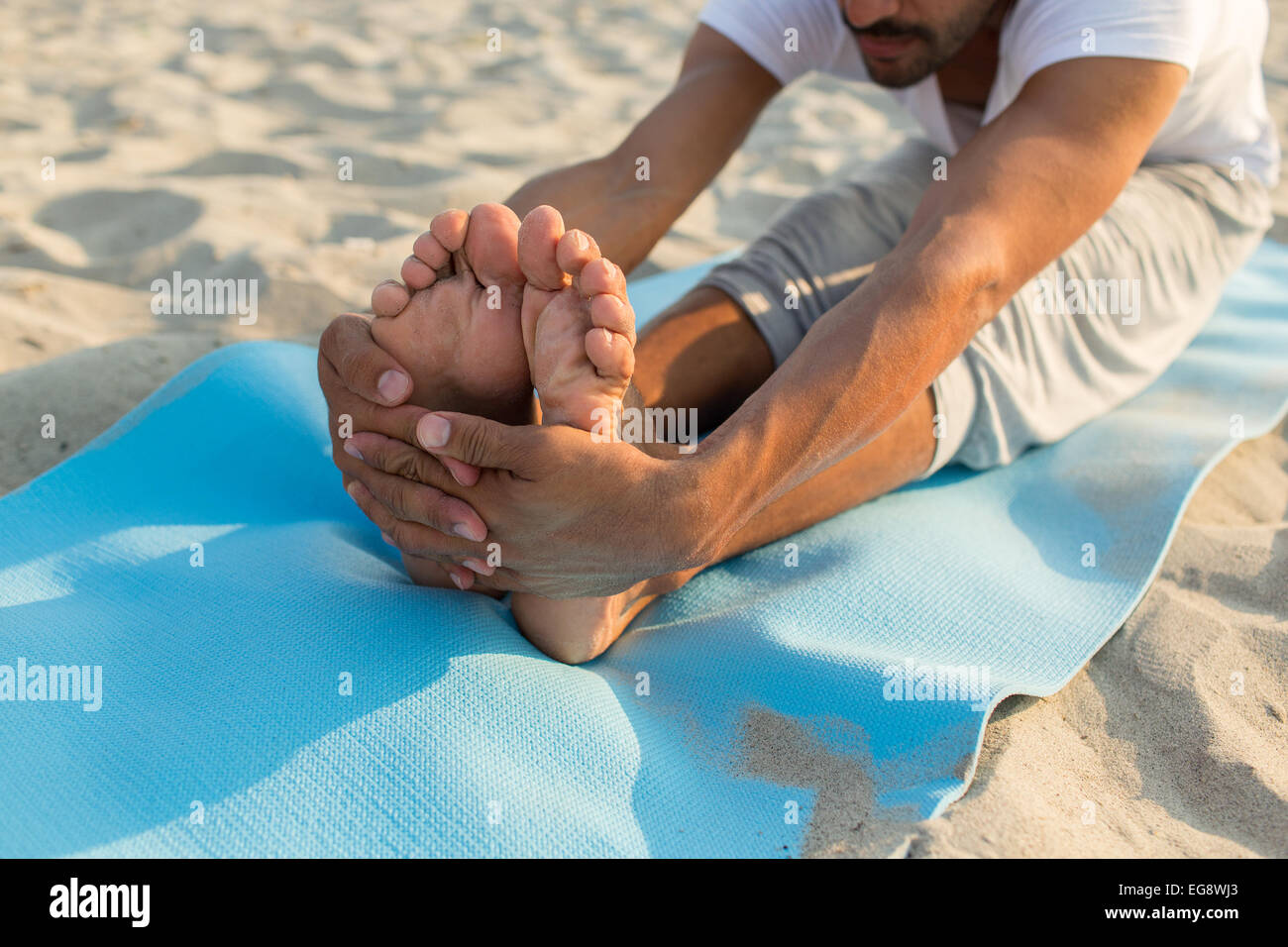 Person training yoga outdoors man hi-res stock photography and images ...