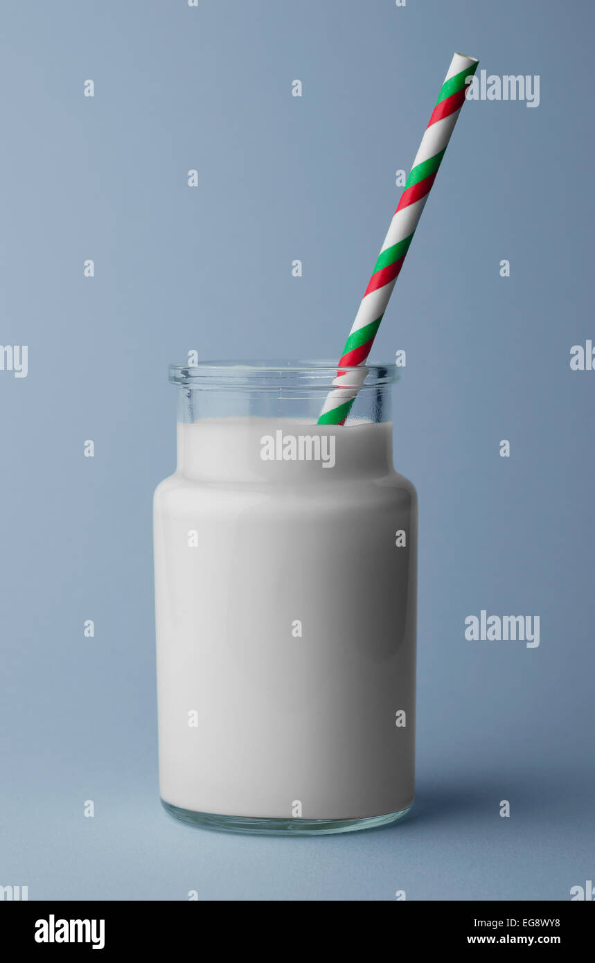 Single glass of milk over blue background Stock Photo - Alamy