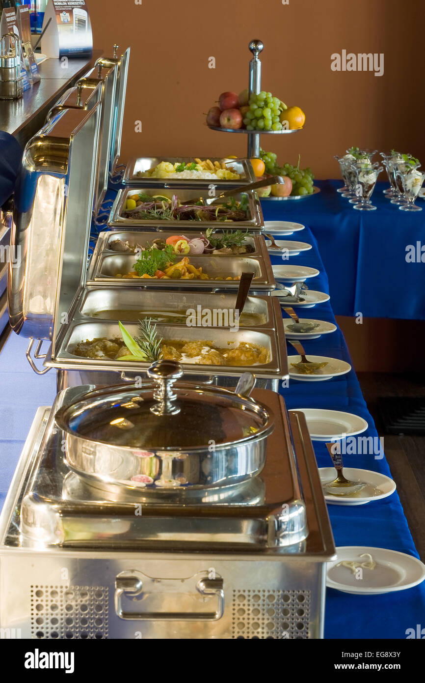 Banquet meals and Metallic banquet meal trays served on tables Stock ...