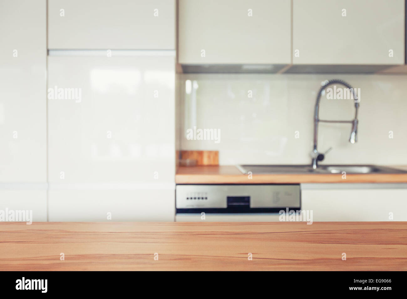 Wooden top and modern kitchen space Stock Photo - Alamy