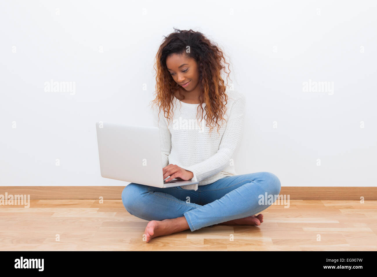 African American student girl using a laptop computer - black people ...