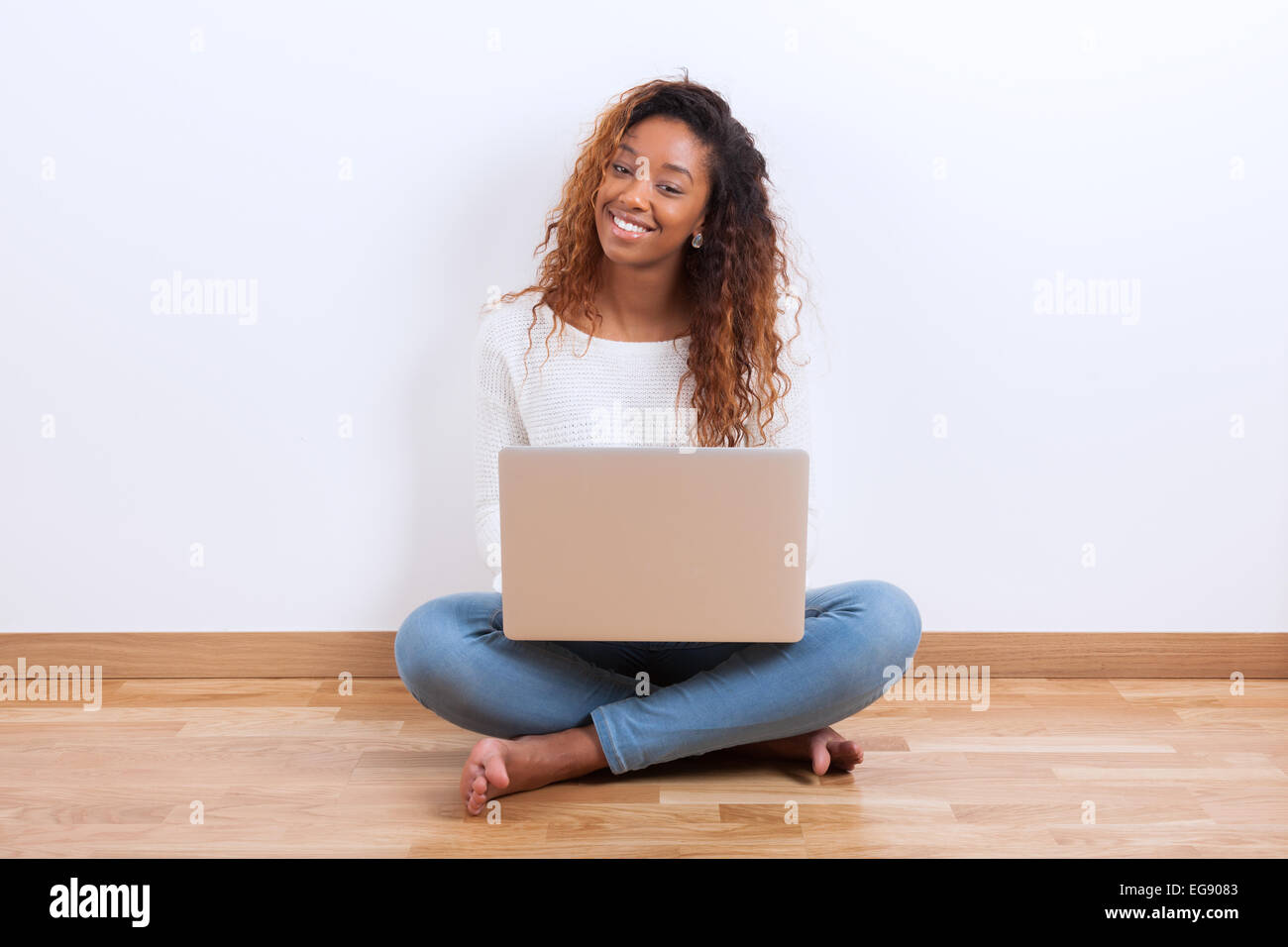 African American student girl using a laptop computer - black people ...