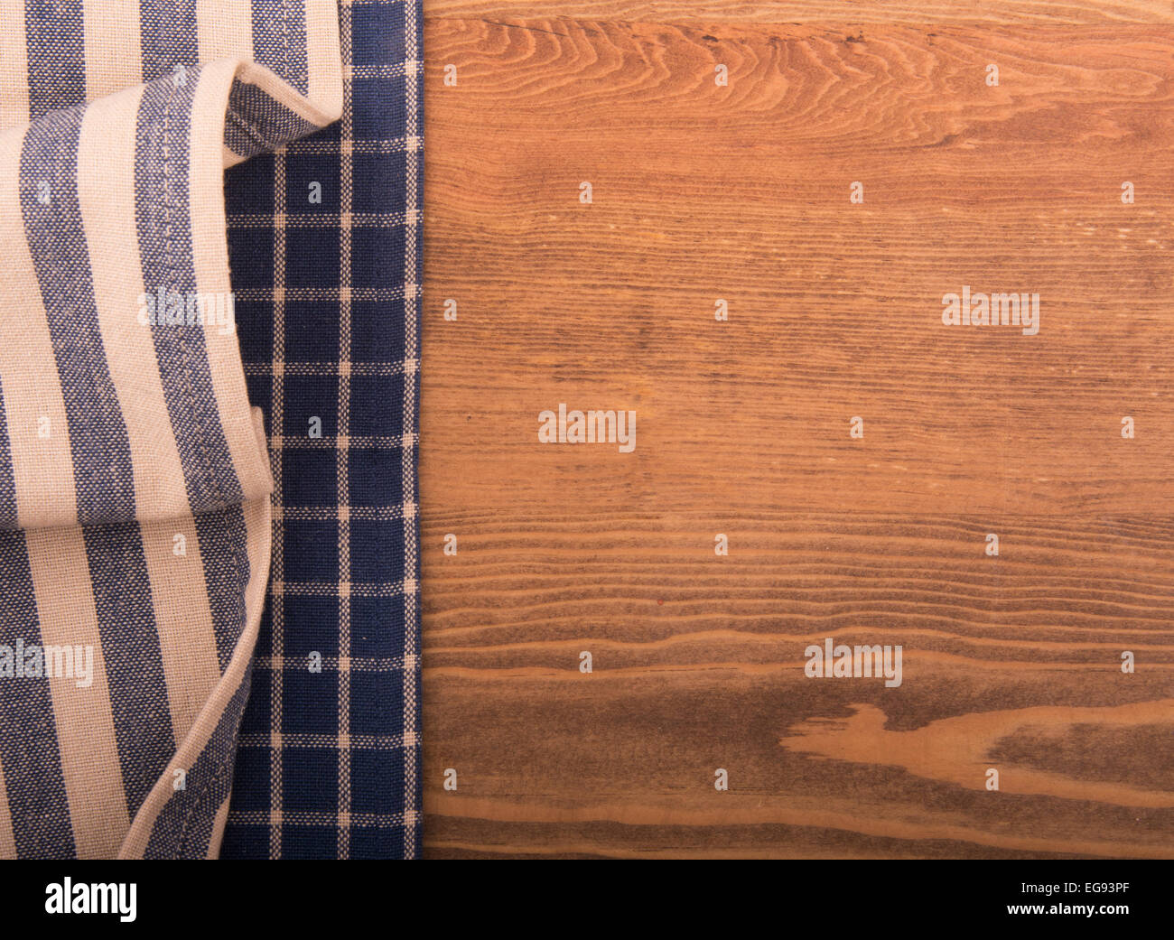 Two kitchen towels on dark wood table Stock Photo - Alamy