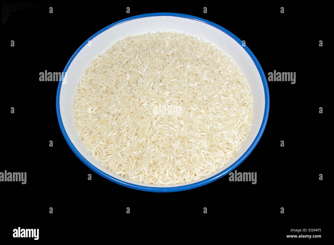 Bowl of uncooked Rice Stock Photo - Alamy