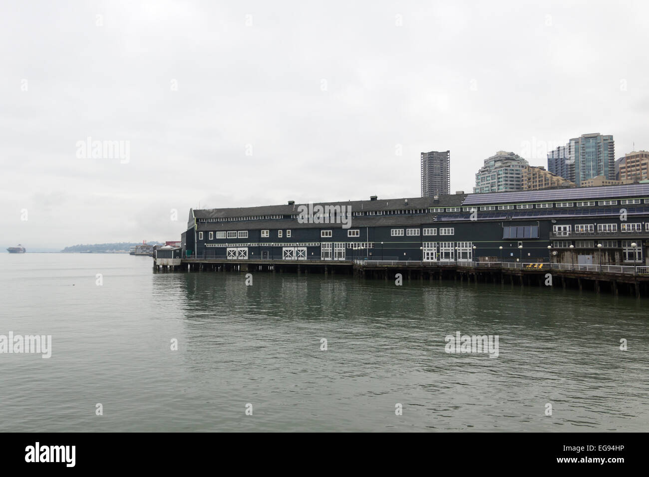 Gray and white warehouse building on the Seattle waterfront, home of ...