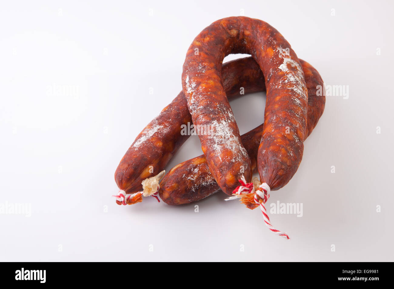 Two red spanish chorizos. Isolated over white background Stock Photo ...