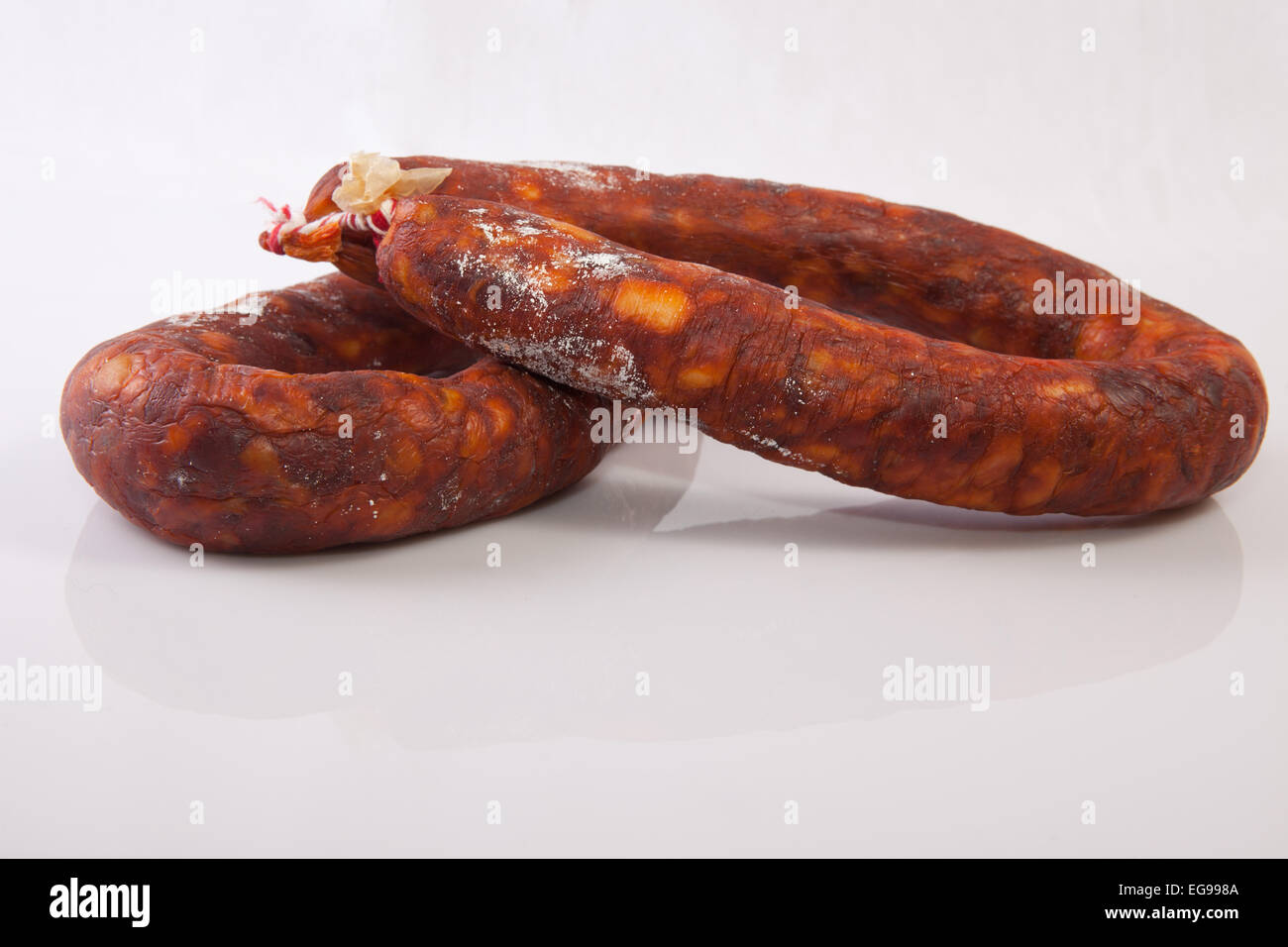 Two red spanish chorizos. Isolated over white background Stock Photo ...