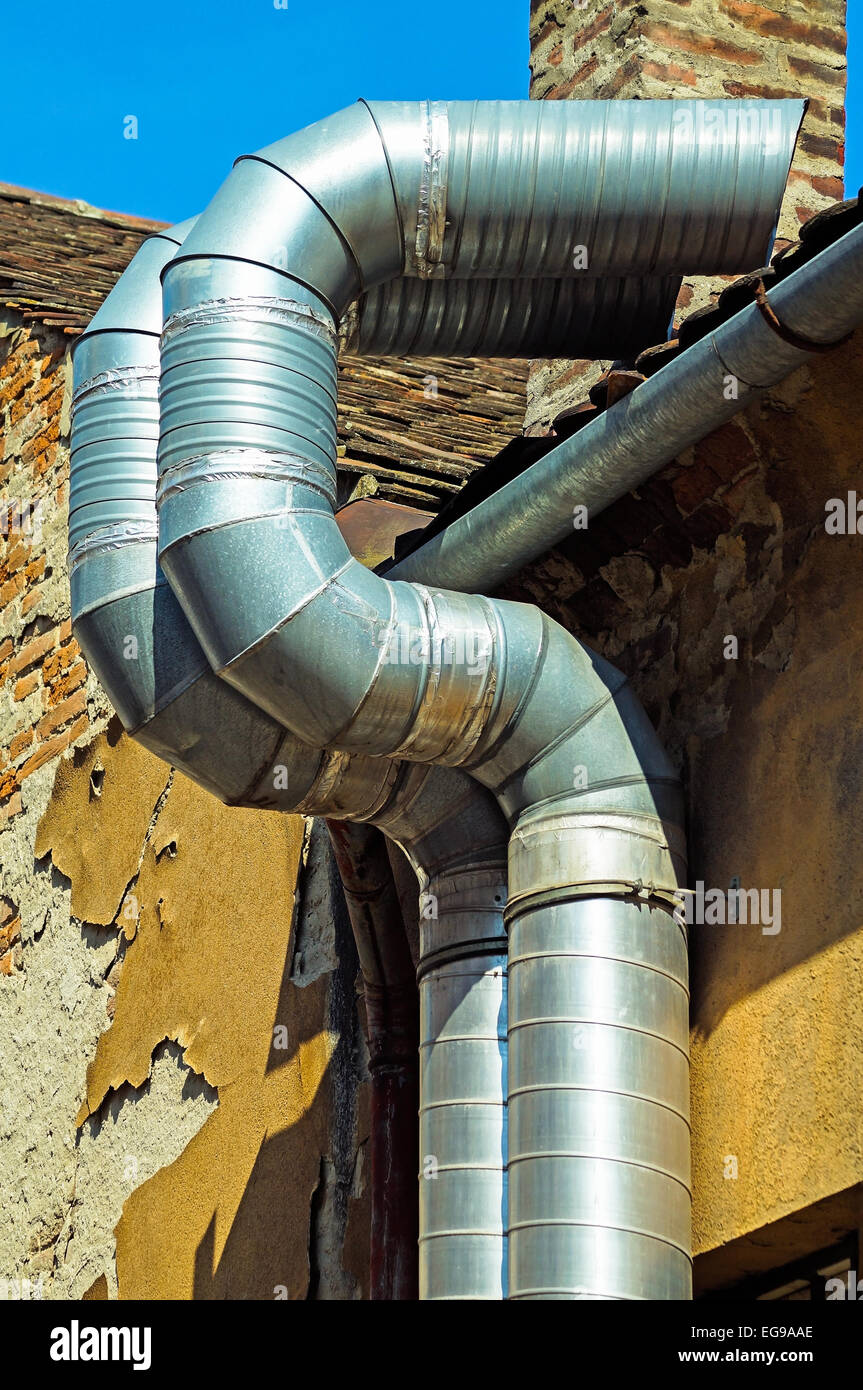 Steel pipes of the old factory building Stock Photo - Alamy