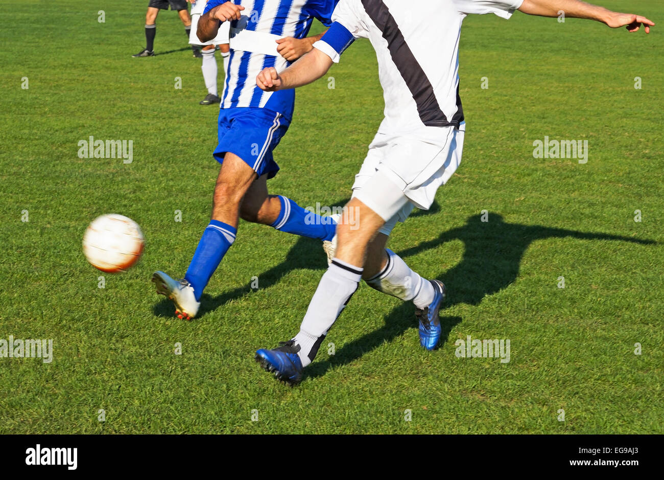 Soccer players in action Stock Photo - Alamy