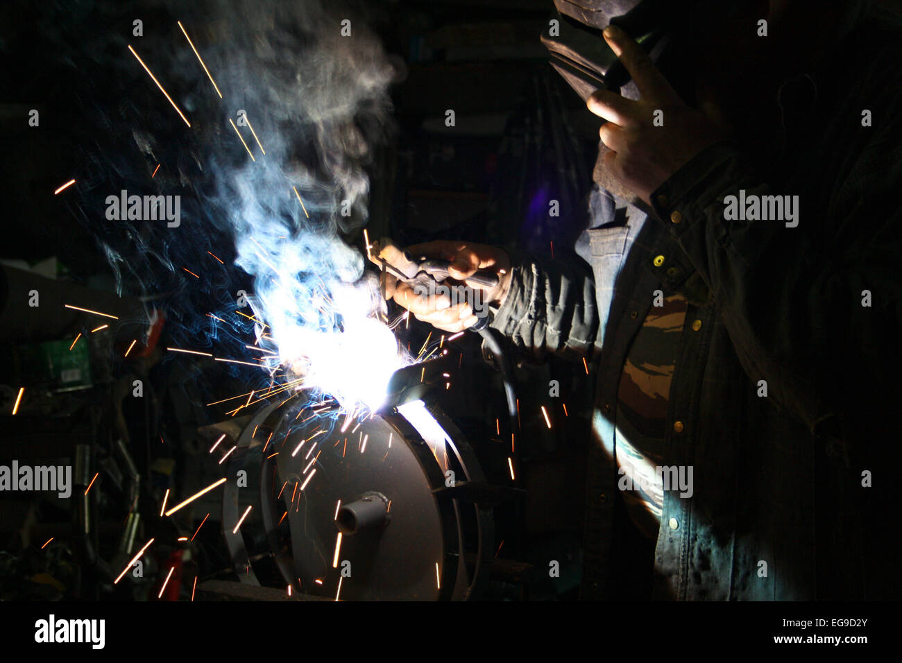 The expert works with electric welding of metal Stock Photo - Alamy