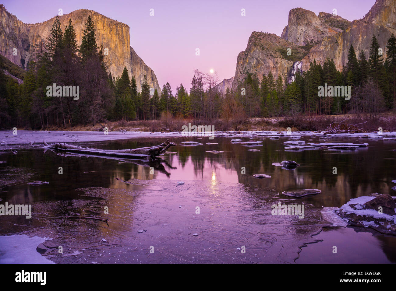 USA, California, Yosemite National Park, Moon and rocks reflecting in ...