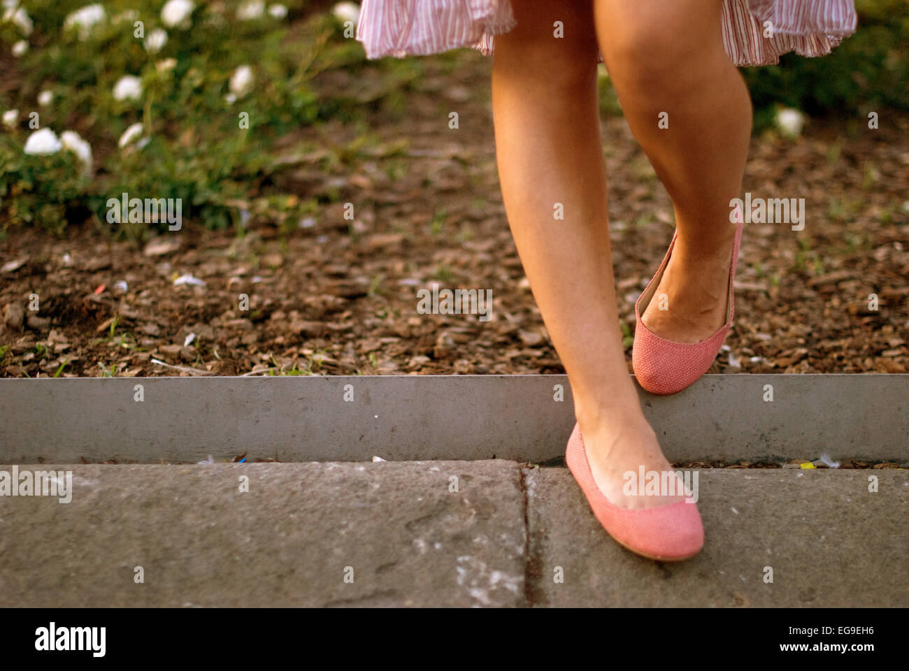 Spain, Catalonia, Barcelona, View of woman's legs in ballerina shoe ...