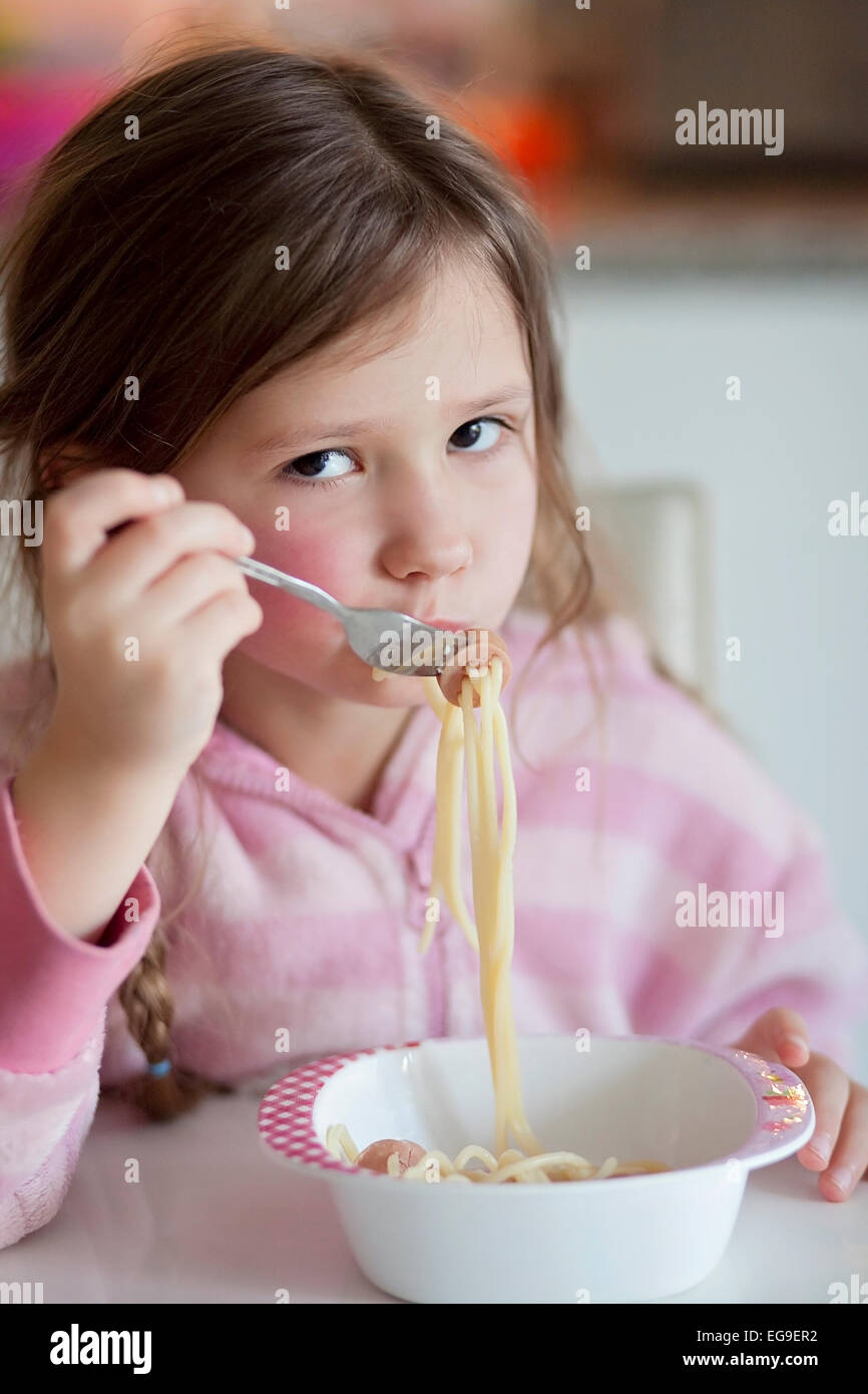 Girl eating spaghetti hi-res stock photography and images - Alamy