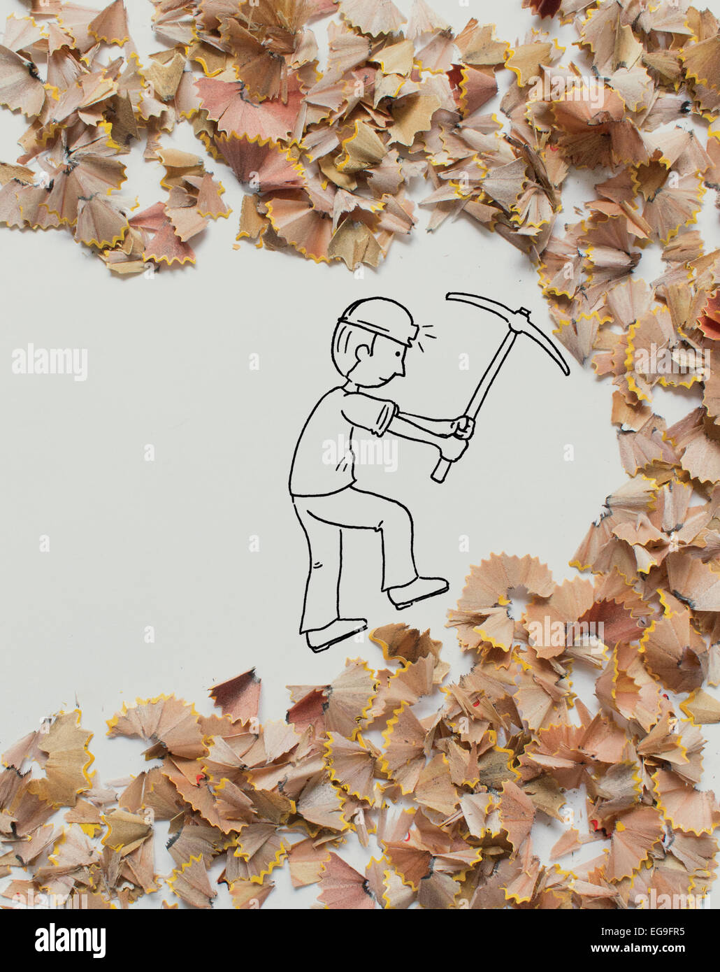 Conceptual miner digging coal in a mine Stock Photo - Alamy