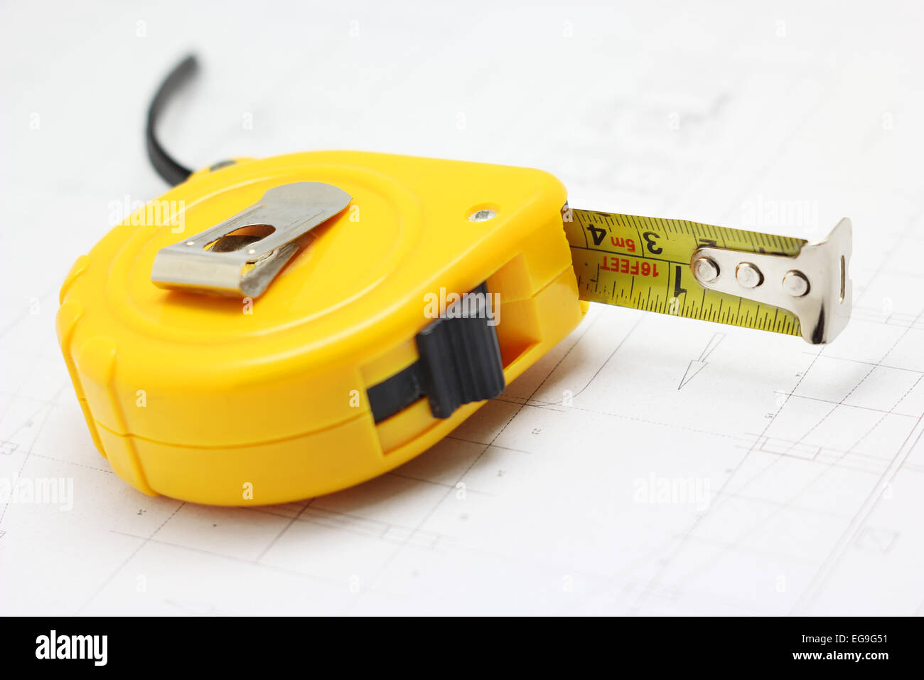measuring tape on floor plan background Stock Photo - Alamy