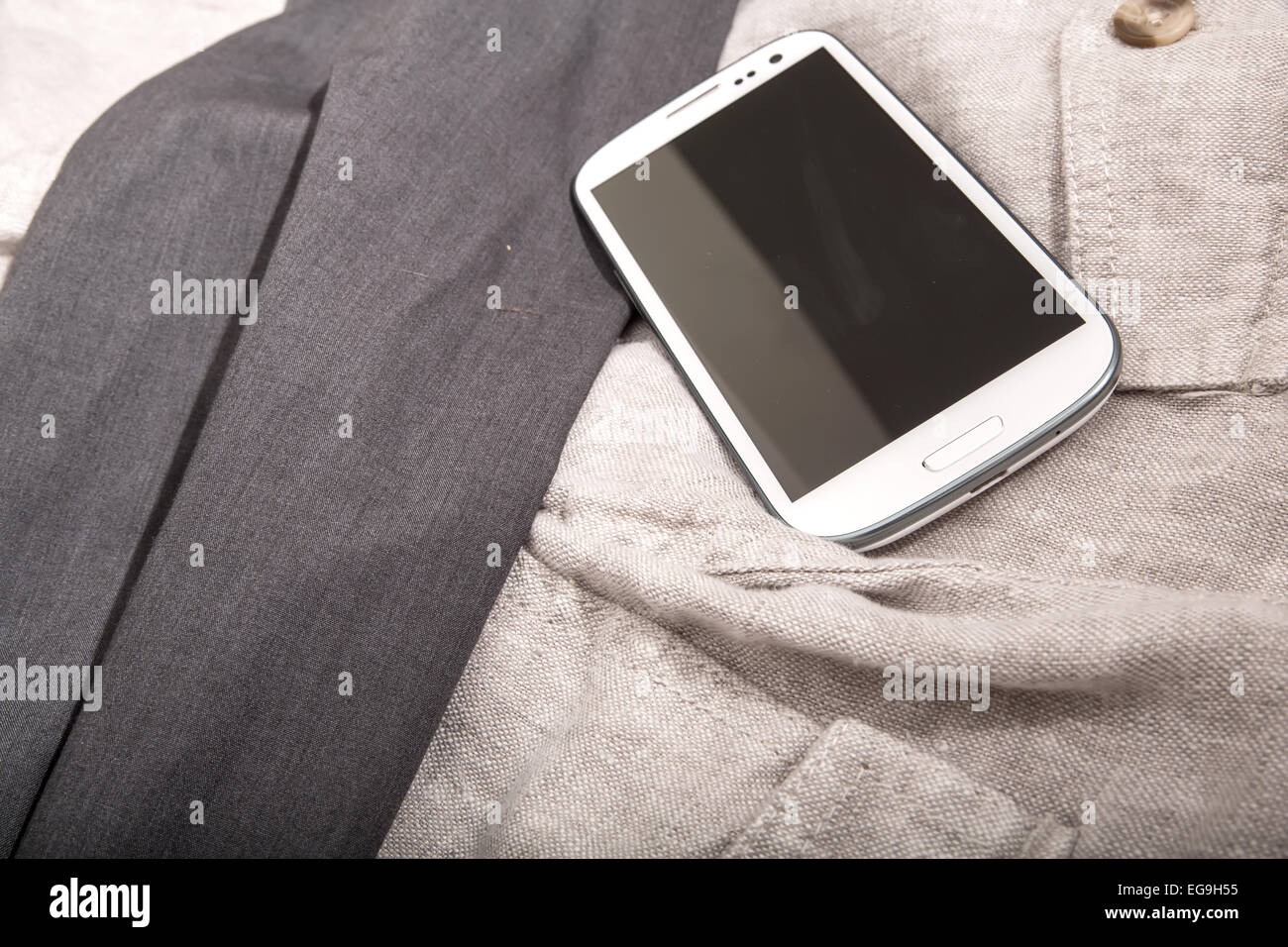 A Smartphone on some dark cloth Stock Photo - Alamy
