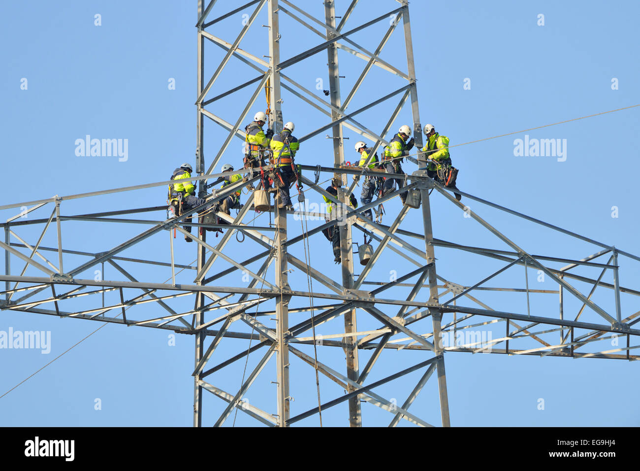 Overhead linemen working on a pylon, Waiblingen, Baden-Württemberg ...