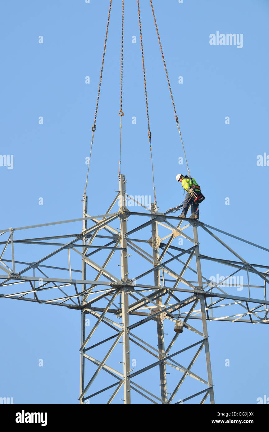 Overhead lineman working on a pylon, Waiblingen, Baden-Württemberg ...