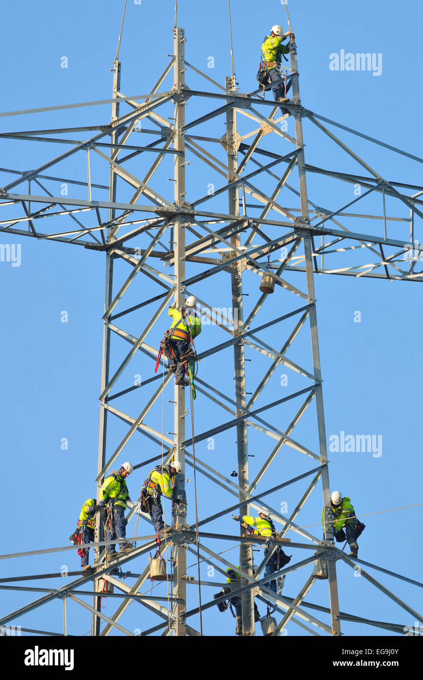 Overhead linemen working on a pylon, Waiblingen, Baden-Württemberg ...