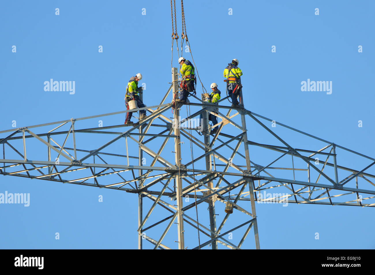 Overhead linemen working on a pylon, Waiblingen, Baden-Württemberg ...