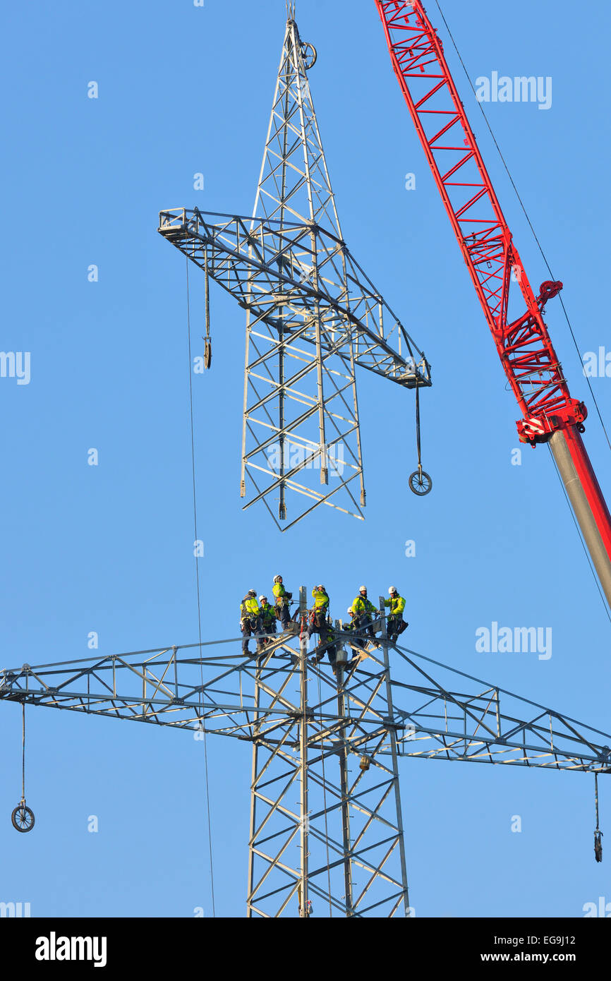 Overhead linemen working on a pylon, Waiblingen, Baden-Württemberg ...