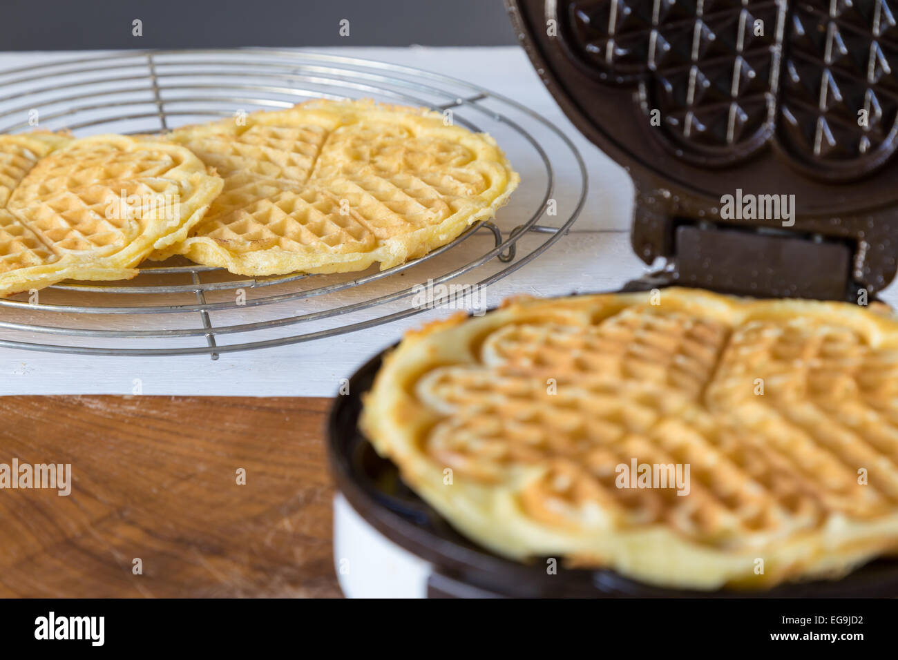 Homemade waffles are cooked in a waffle iron Stock Photo - Alamy