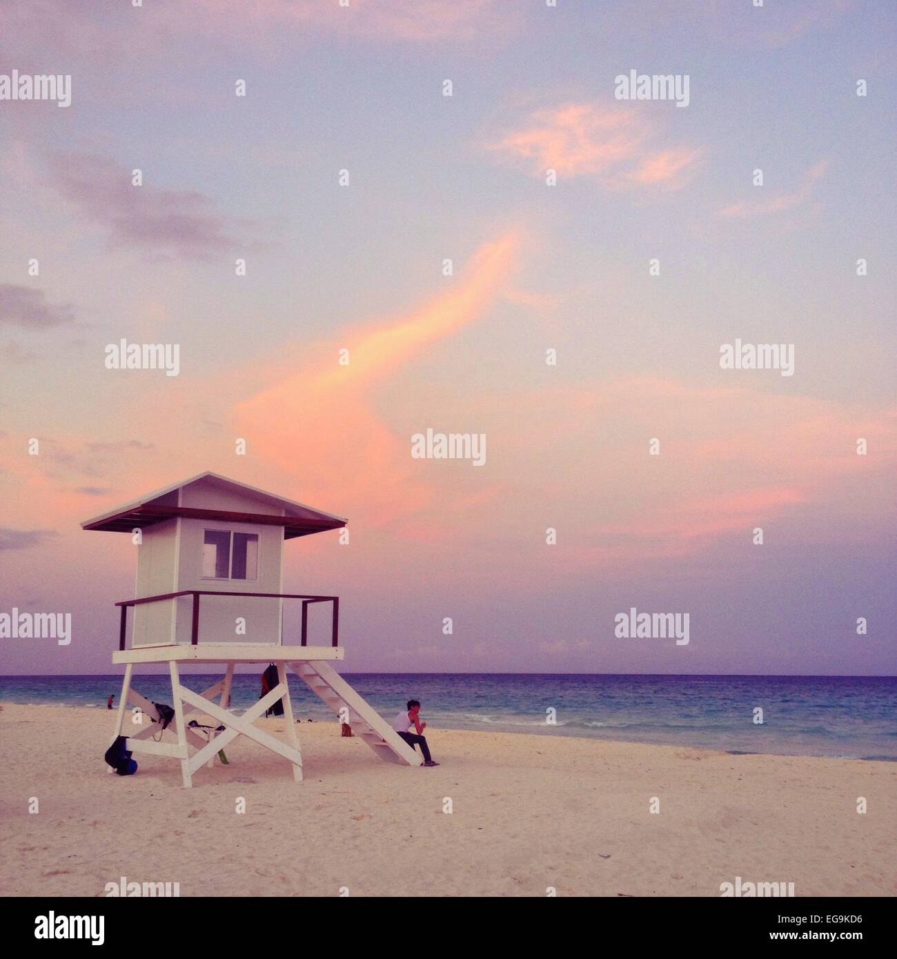 Lifeguard stand at sunset Stock Photo - Alamy