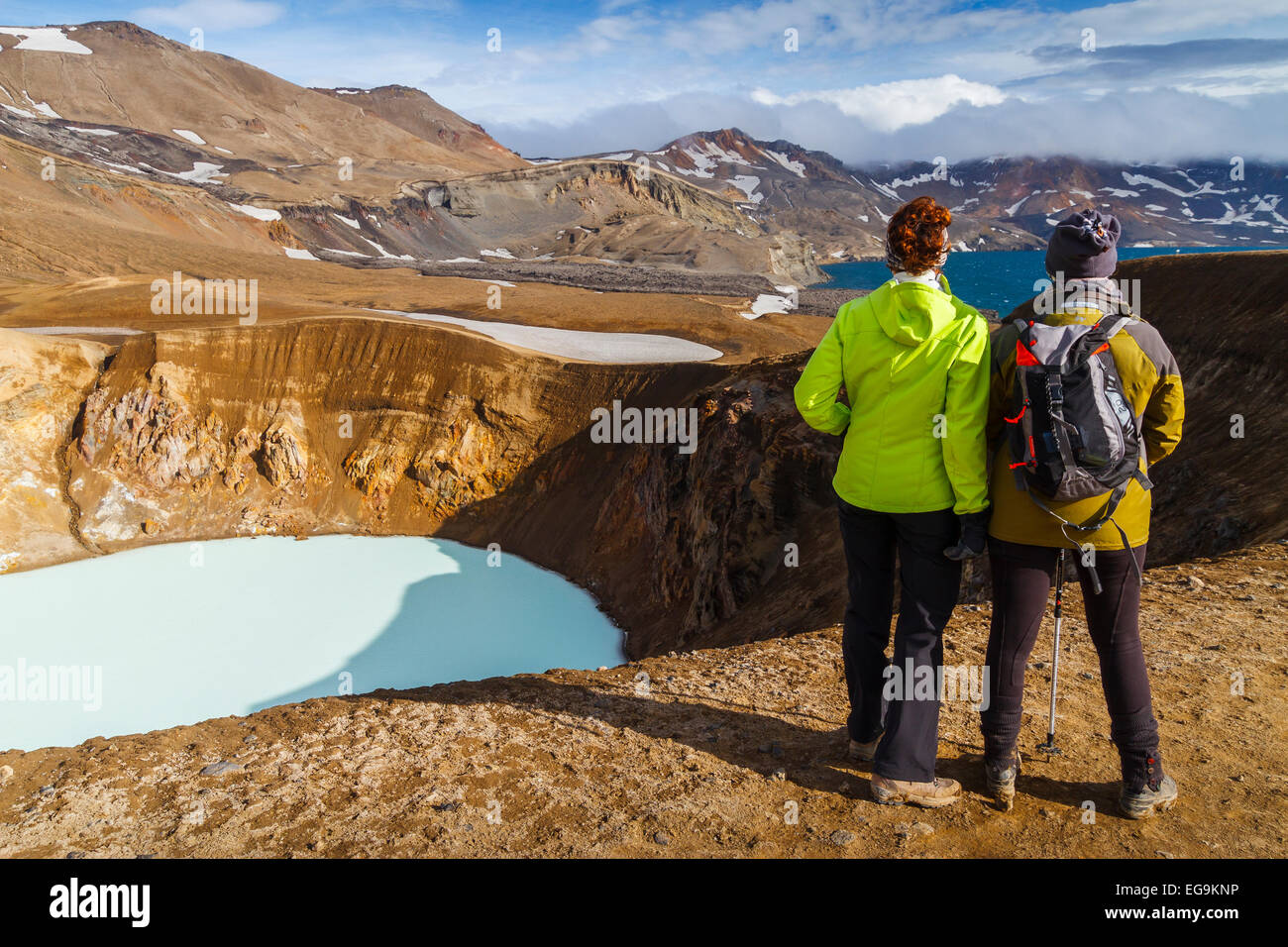 Hikers near Viti geothermal lake and Askja caldera. Central Highlands ...