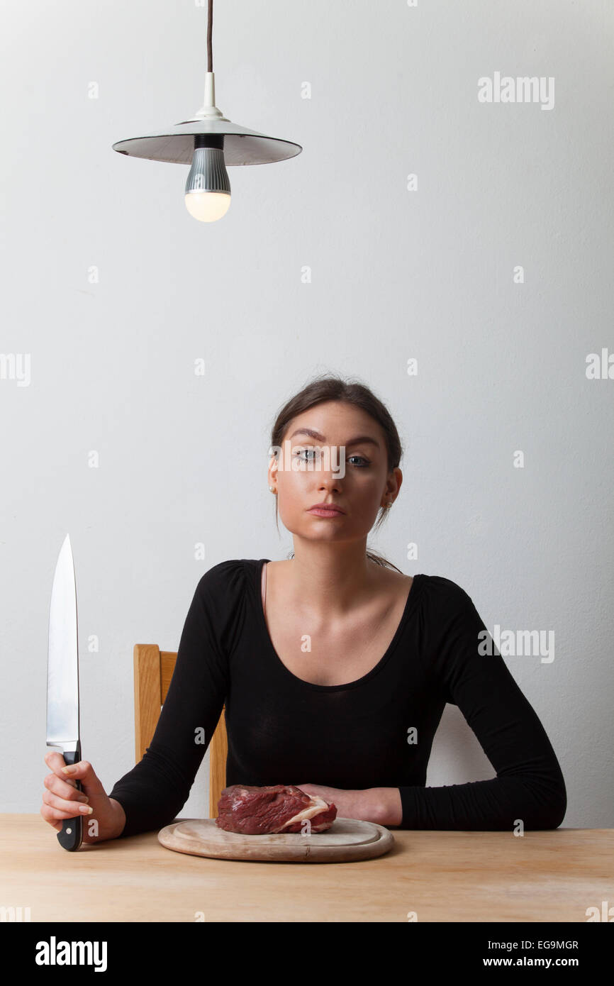 Woman chopping meat hi-res stock photography and images - Alamy