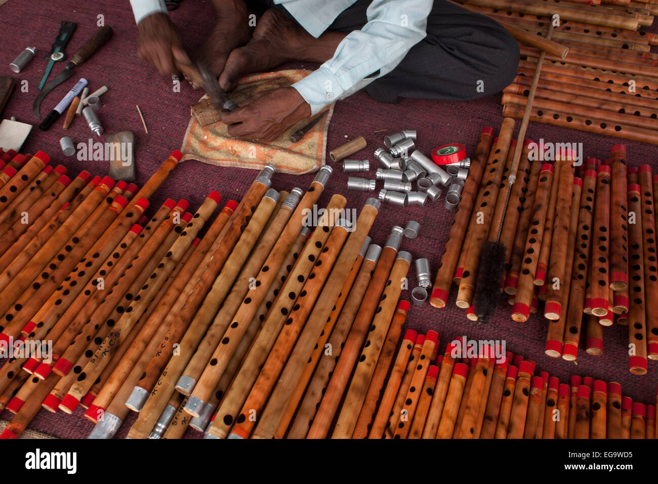 A flute maker making flute in Dhaka Stock Photo - Alamy