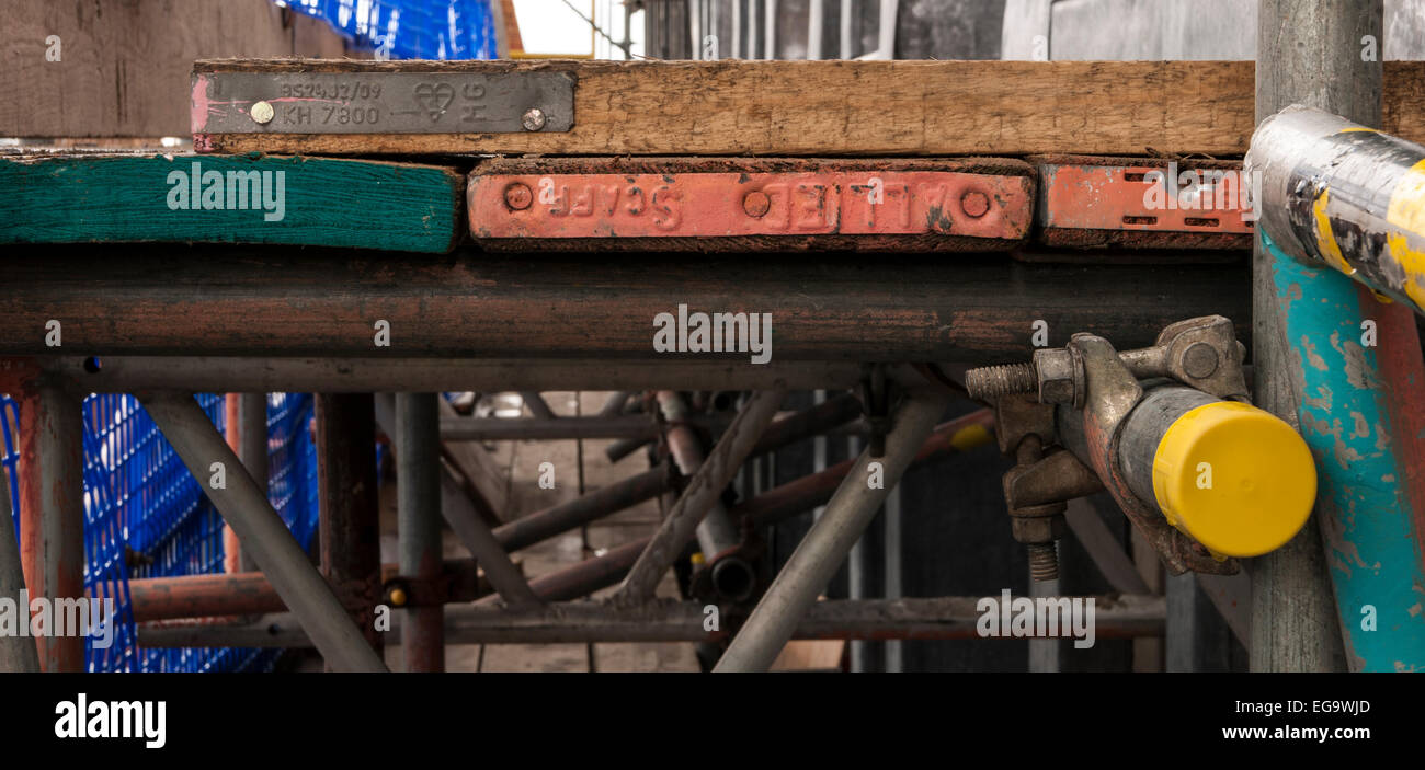 photo of scaffolding showing ends of boards and tubular scaffold poles ...