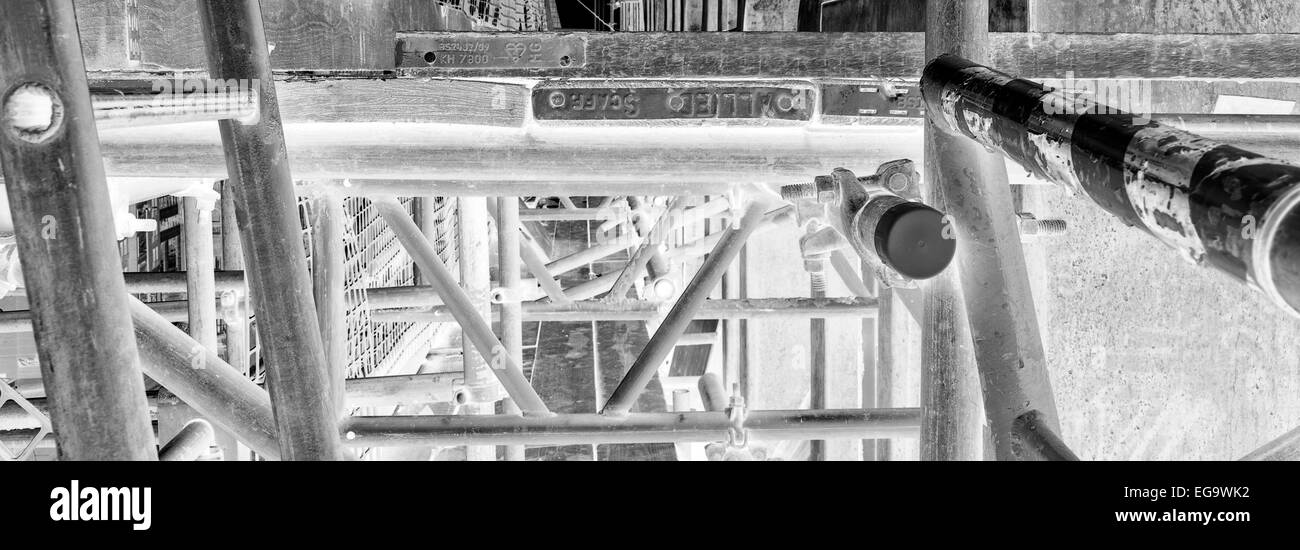 Negative photo of scaffolding showing ends of boards and tubular ...