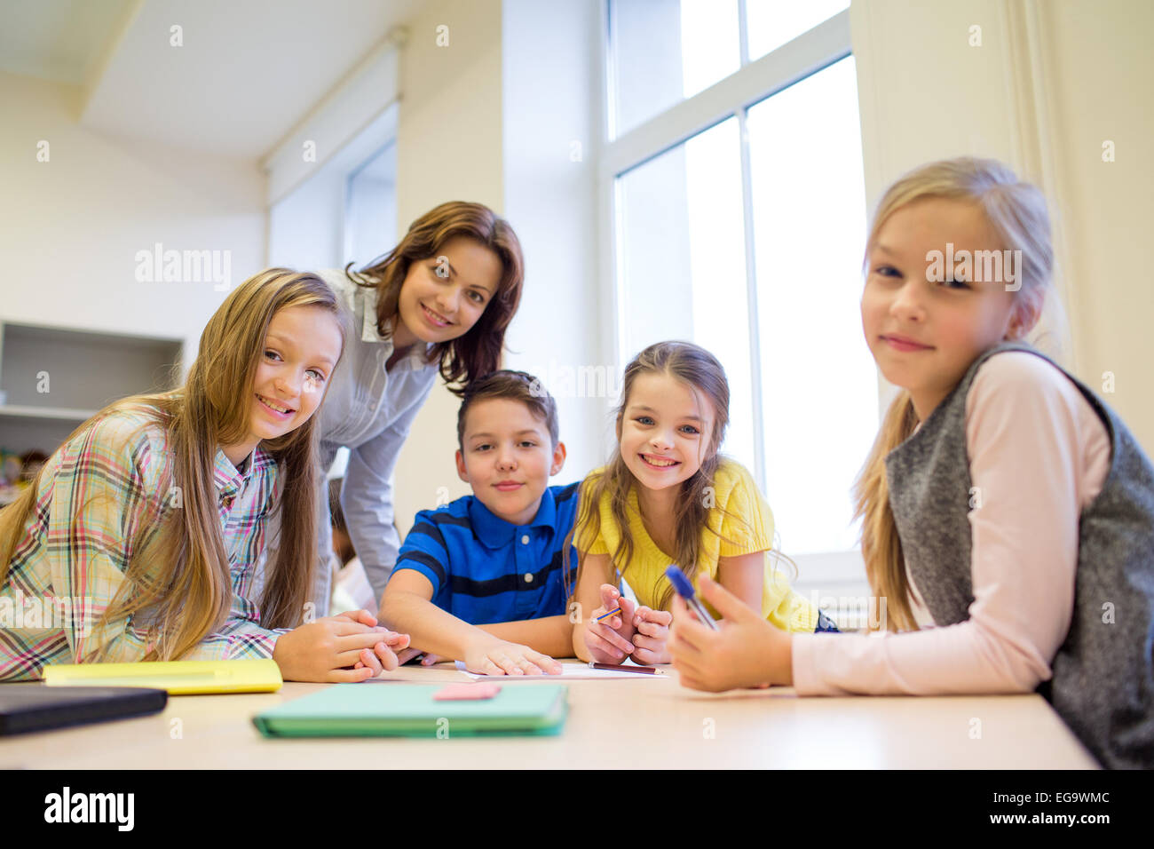 group of school kids writing test in classroom Stock Photo - Alamy