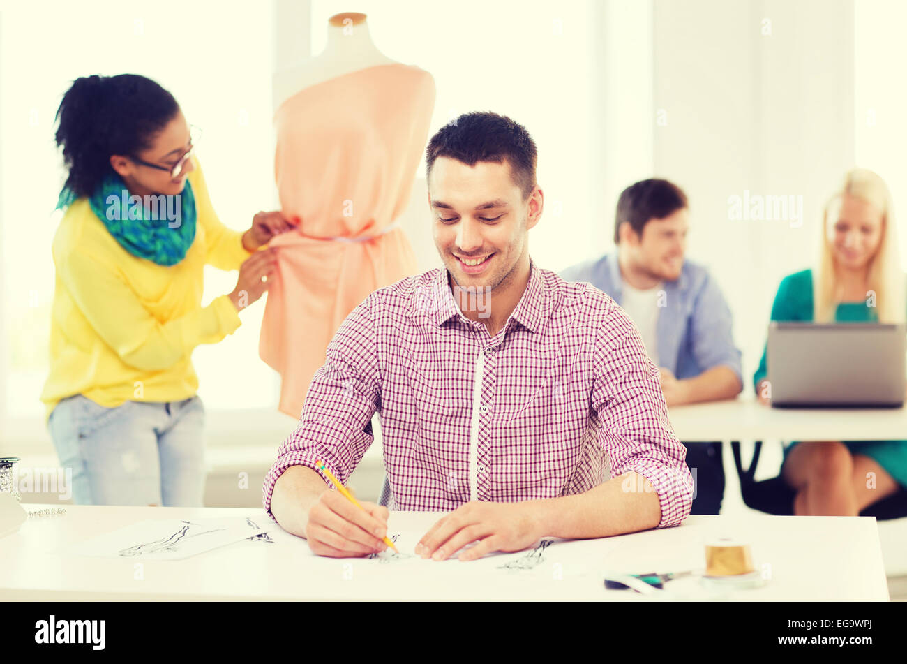 Female fashion designers drawing sketches hi-res stock photography and ...