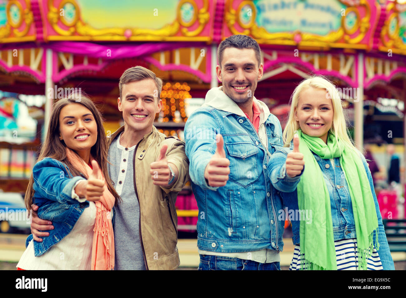 group of smiling friends showing thumbs up Stock Photo - Alamy