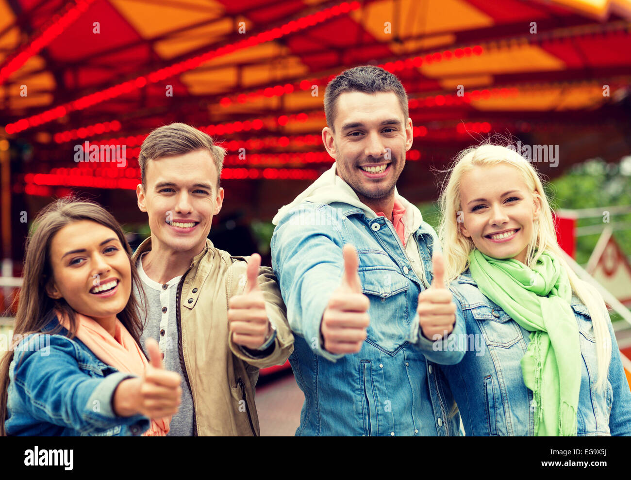 group of smiling friends showing thumbs up Stock Photo - Alamy