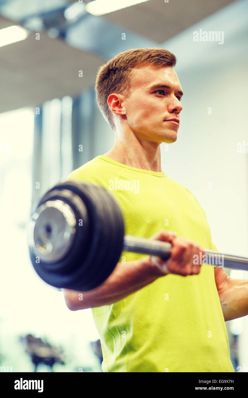man doing exercise with barbell in gym Stock Photo - Alamy