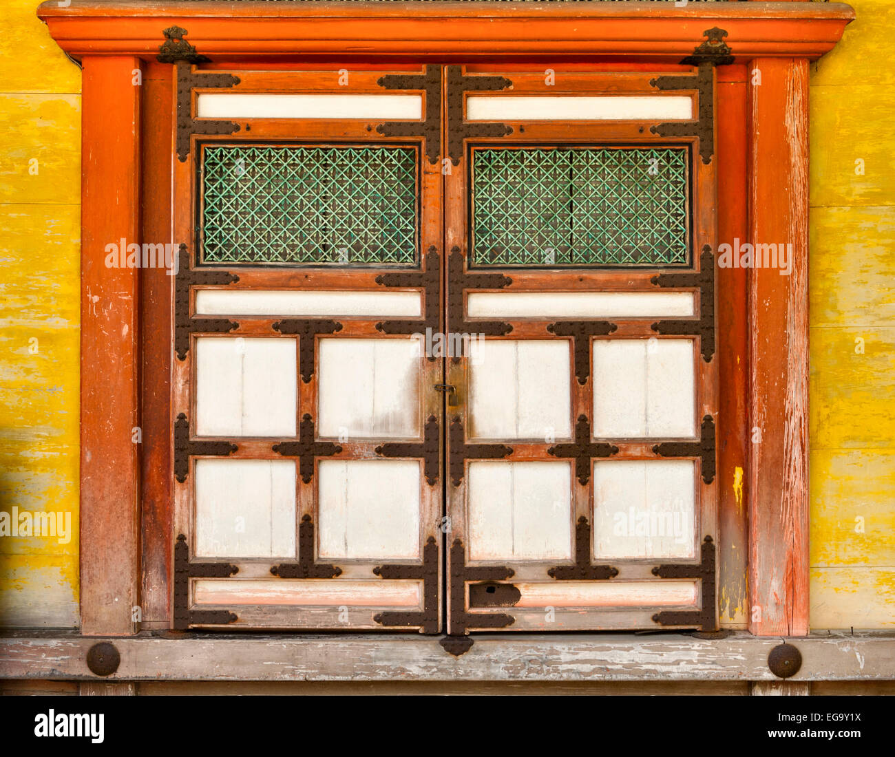 Brightly painted red and yellow wooden doors at the 15c Konchi-in zen ...