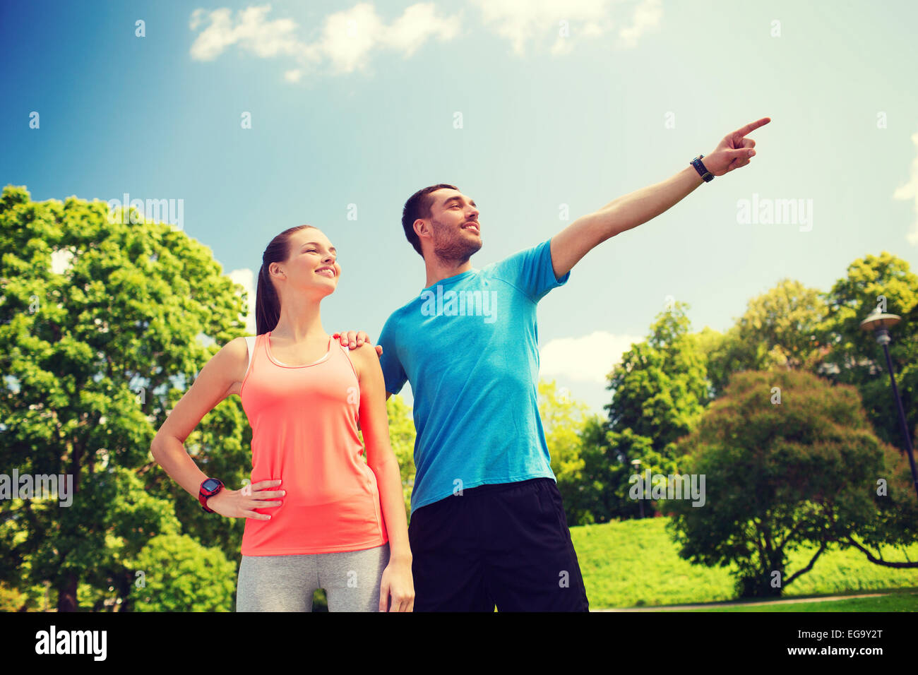 two smiling people outdoors Stock Photo - Alamy