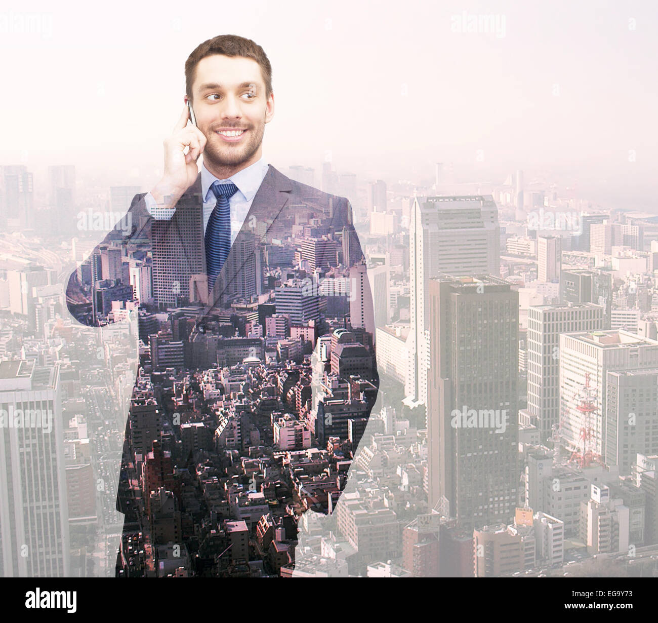 smiling young businessman over city background Stock Photo - Alamy