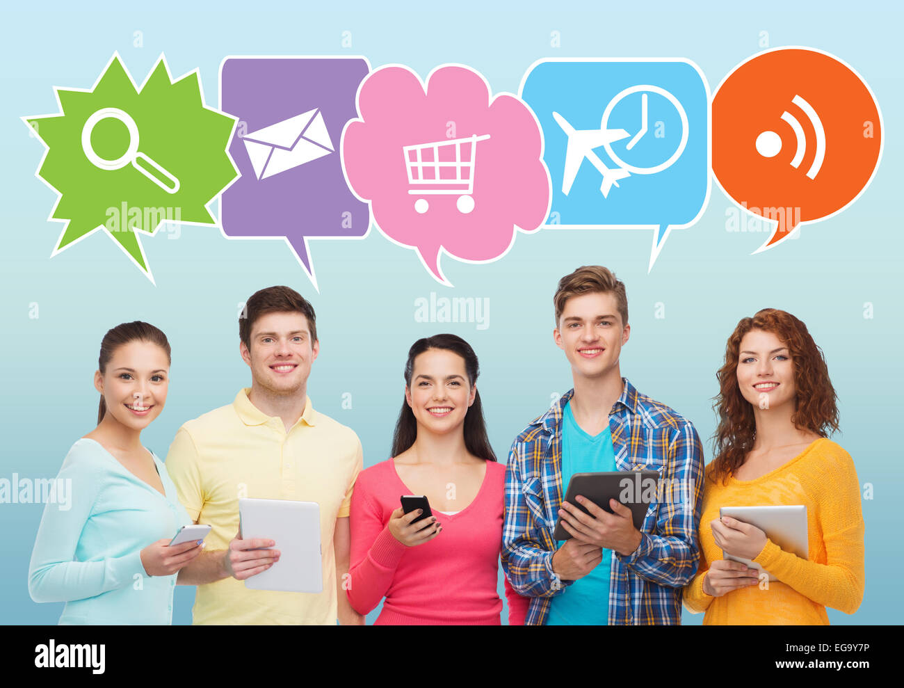 happy friends with smartphones and tablet pc Stock Photo - Alamy