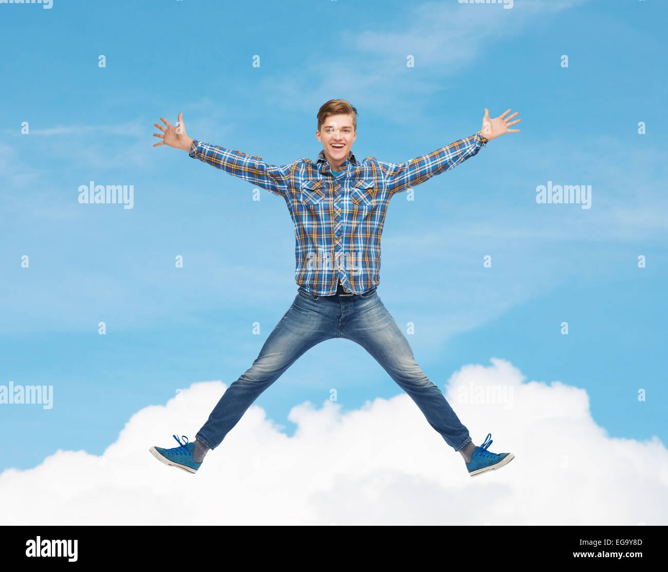 smiling young man jumping in air Stock Photo - Alamy